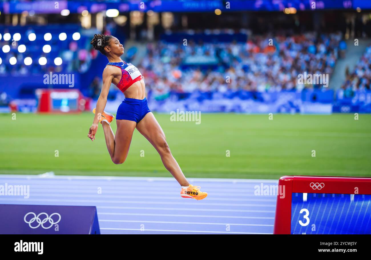 Monae' Nichols participating in the long jump at the Paris 2024 Olympic ...