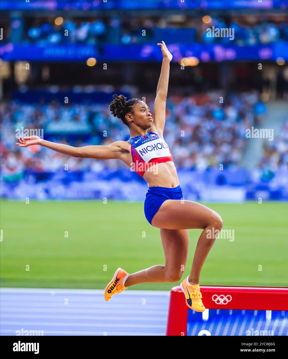 Monae' Nichols participating in the long jump at the Paris 2024 Olympic ...