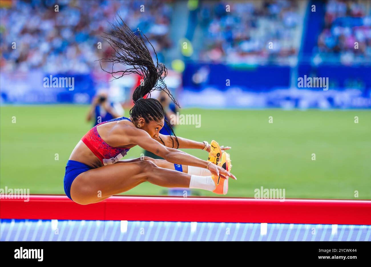 Tara Davis-Woodhall participating in the long jump at the Paris 2024 ...