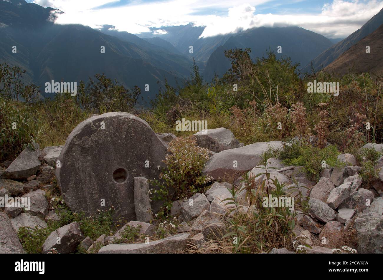 Stone wheel and rocks, historic ruins on Andes Mountains ancient site ...
