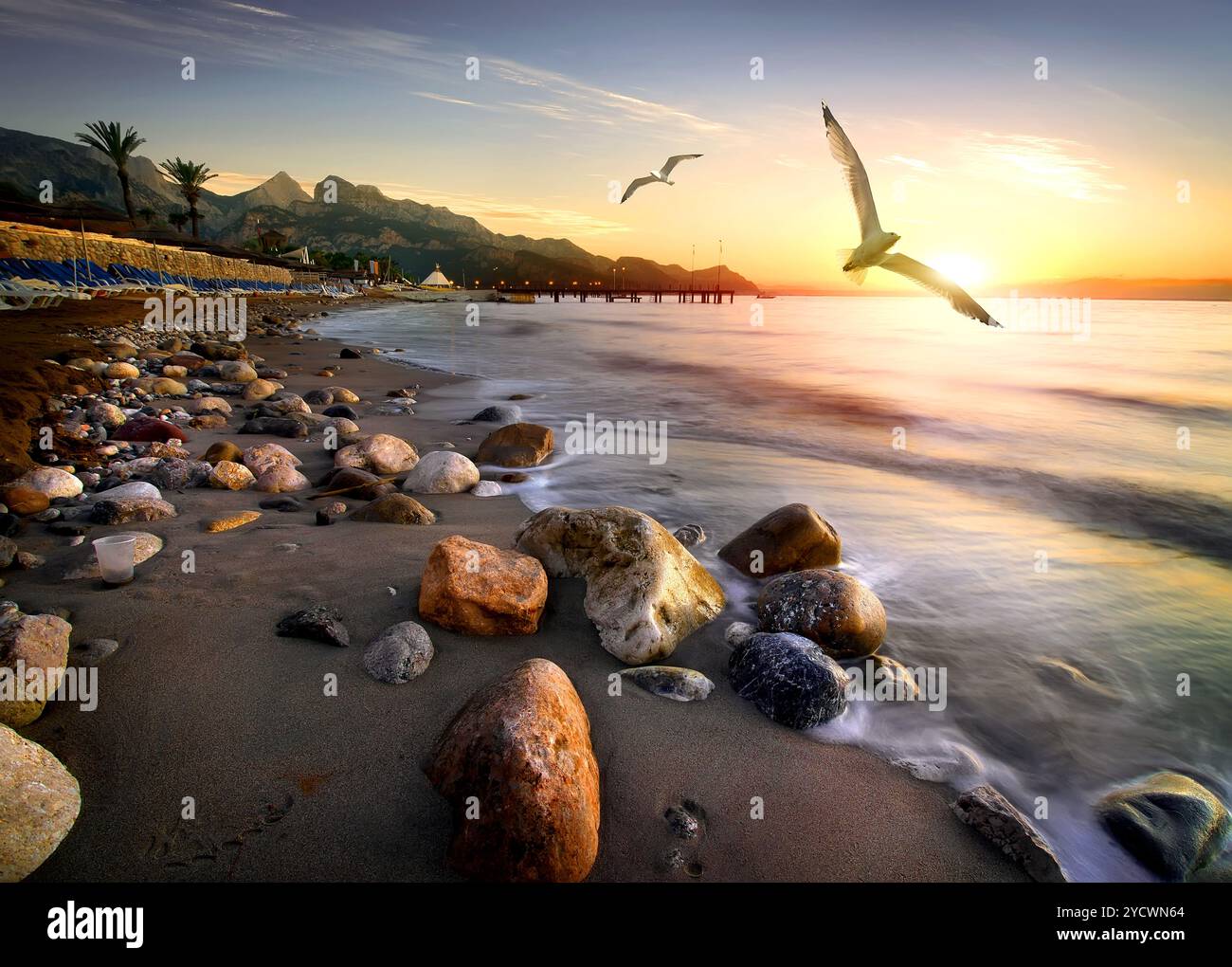 Flying over rock mountain beach hi-res stock photography and images - Alamy