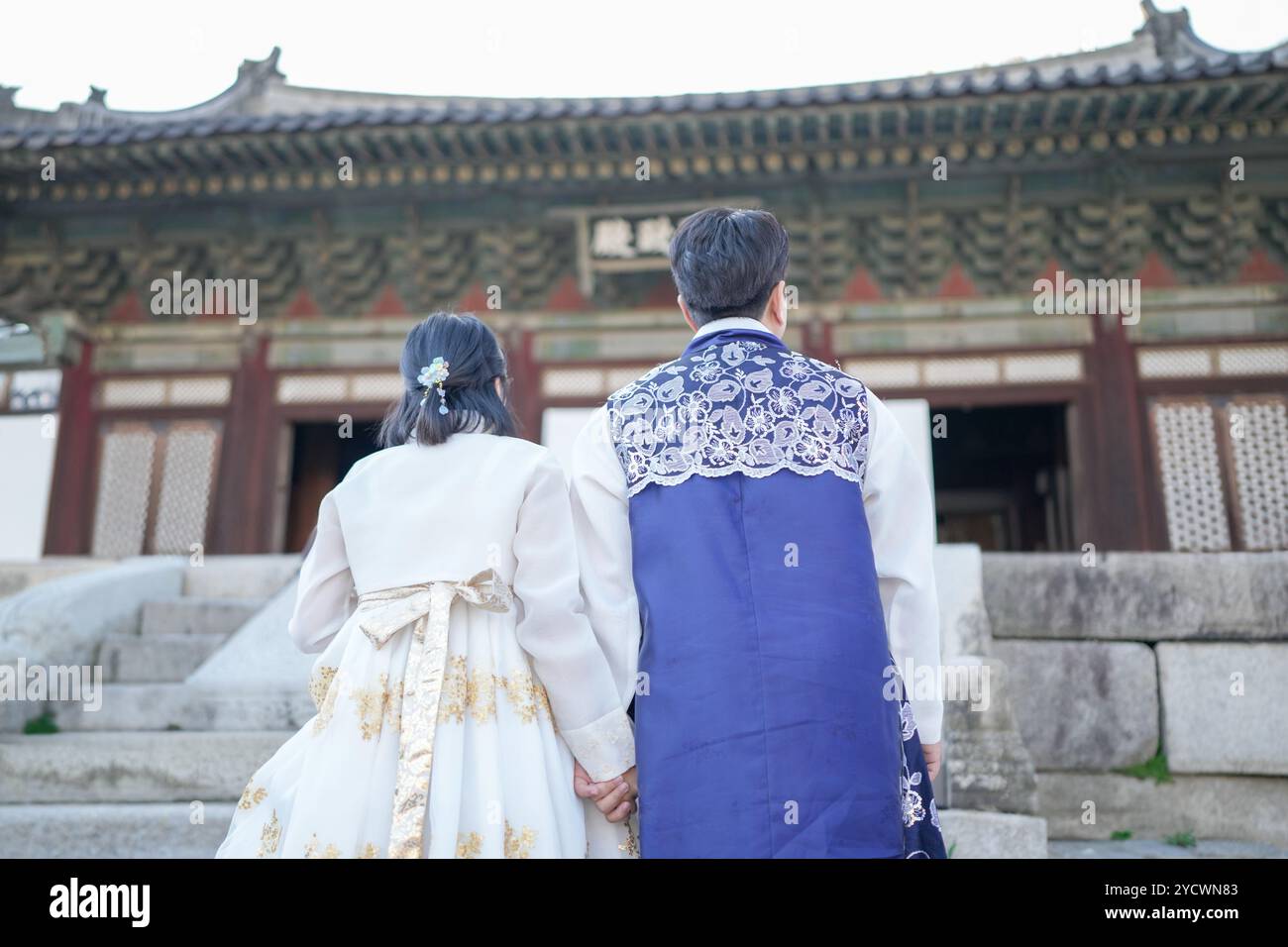 A Korean couple, a man in his 30s and a woman in her 20s, walks ...