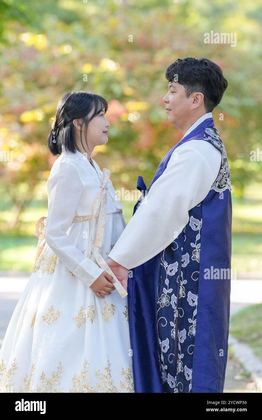 A Korean couple, a man in his 30s and a woman in her 20s, are spending ...