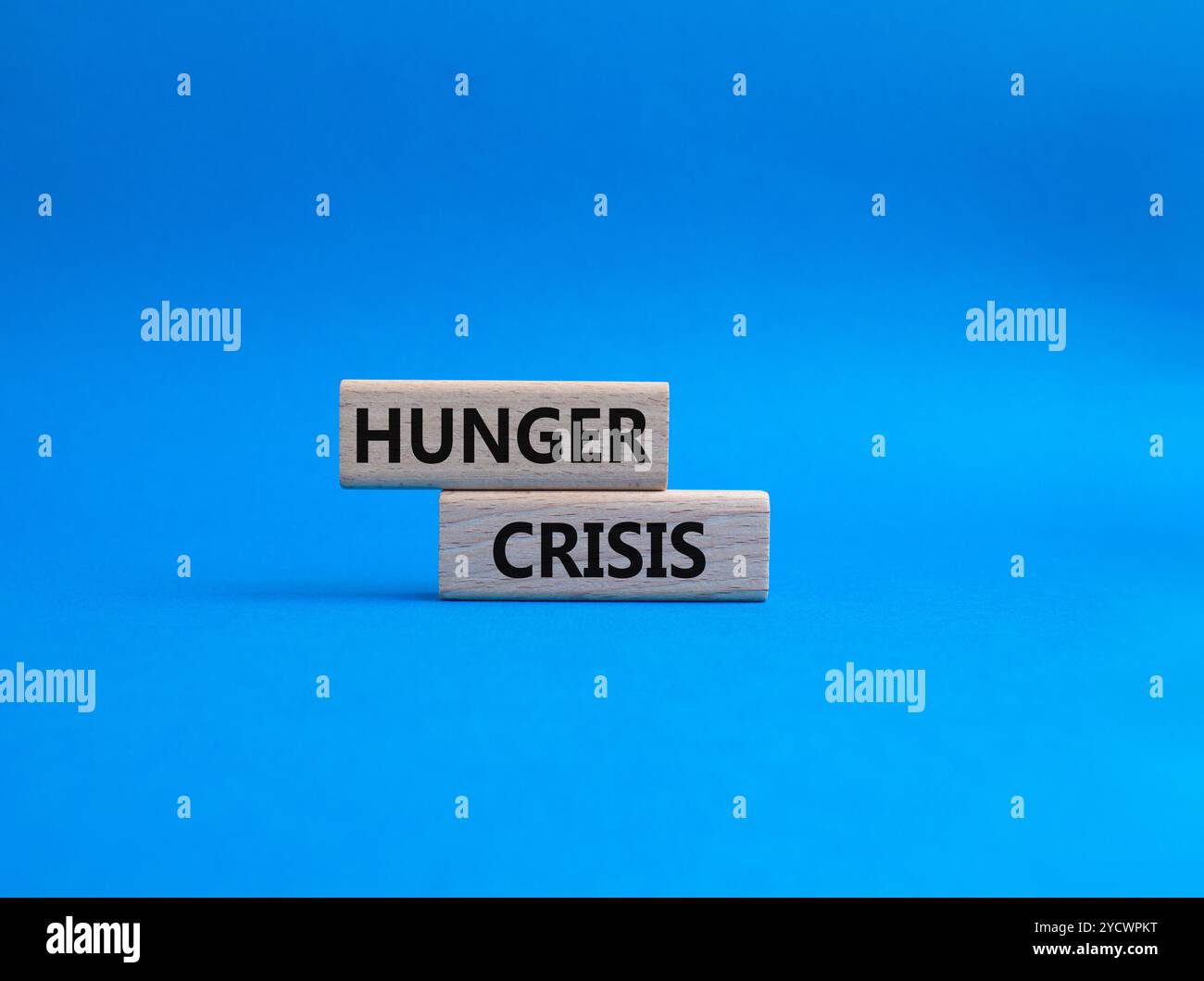 Hunger Crisis symbol. Wooden blocks with words Hunger Crisis. Beautiful ...
