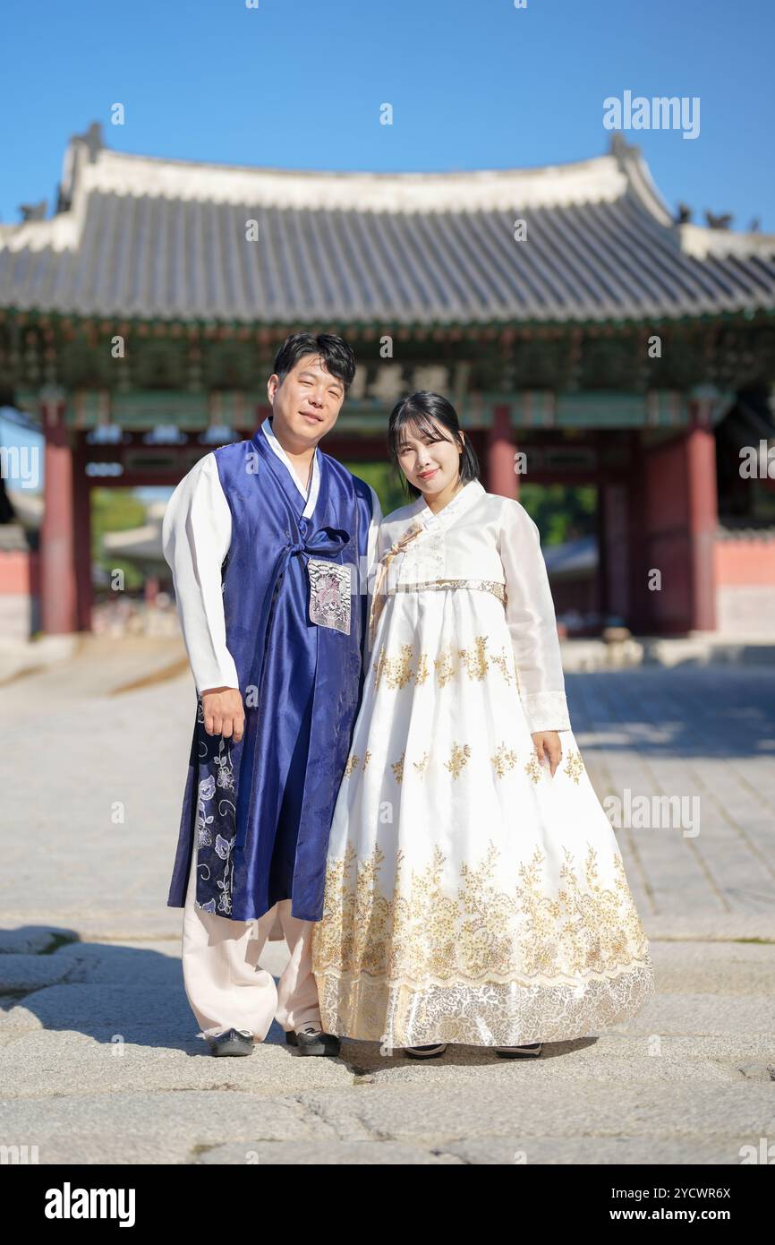 A Korean couple, a man in his 30s and a woman in her 20s, walks ...