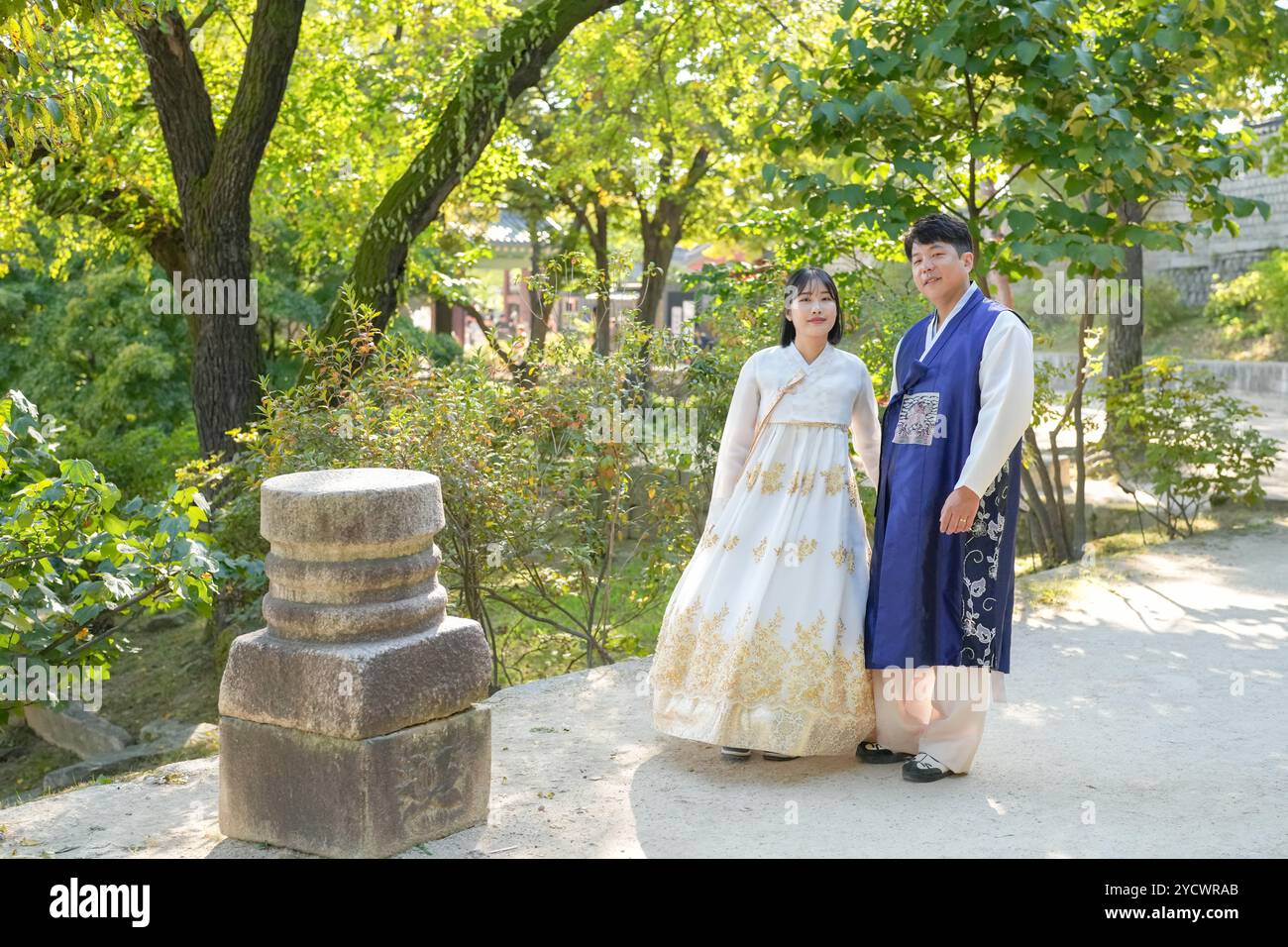 A Korean couple, a man in his 30s and a woman in her 20s, walks ...