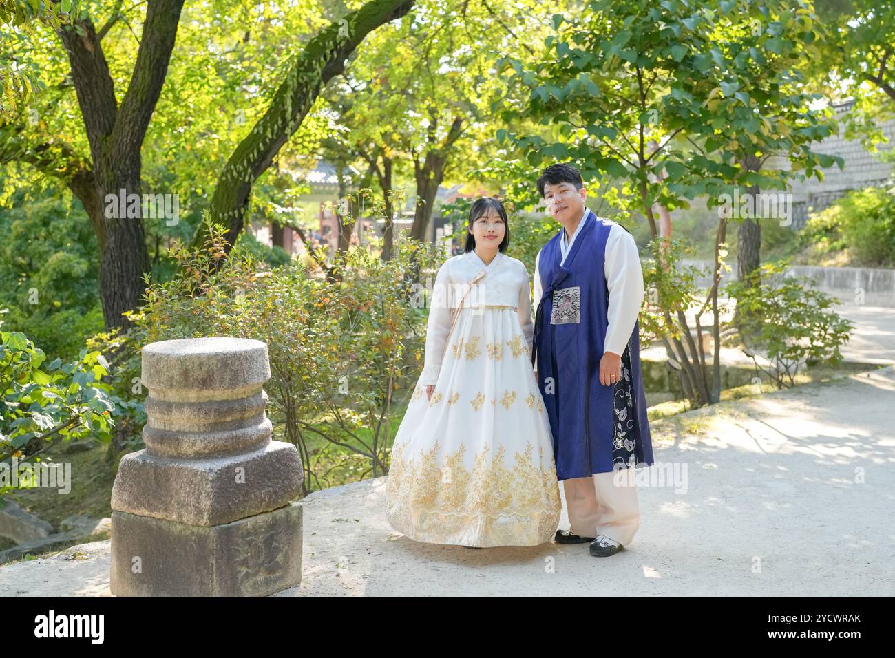 A Korean couple, a man in his 30s and a woman in her 20s, walks ...