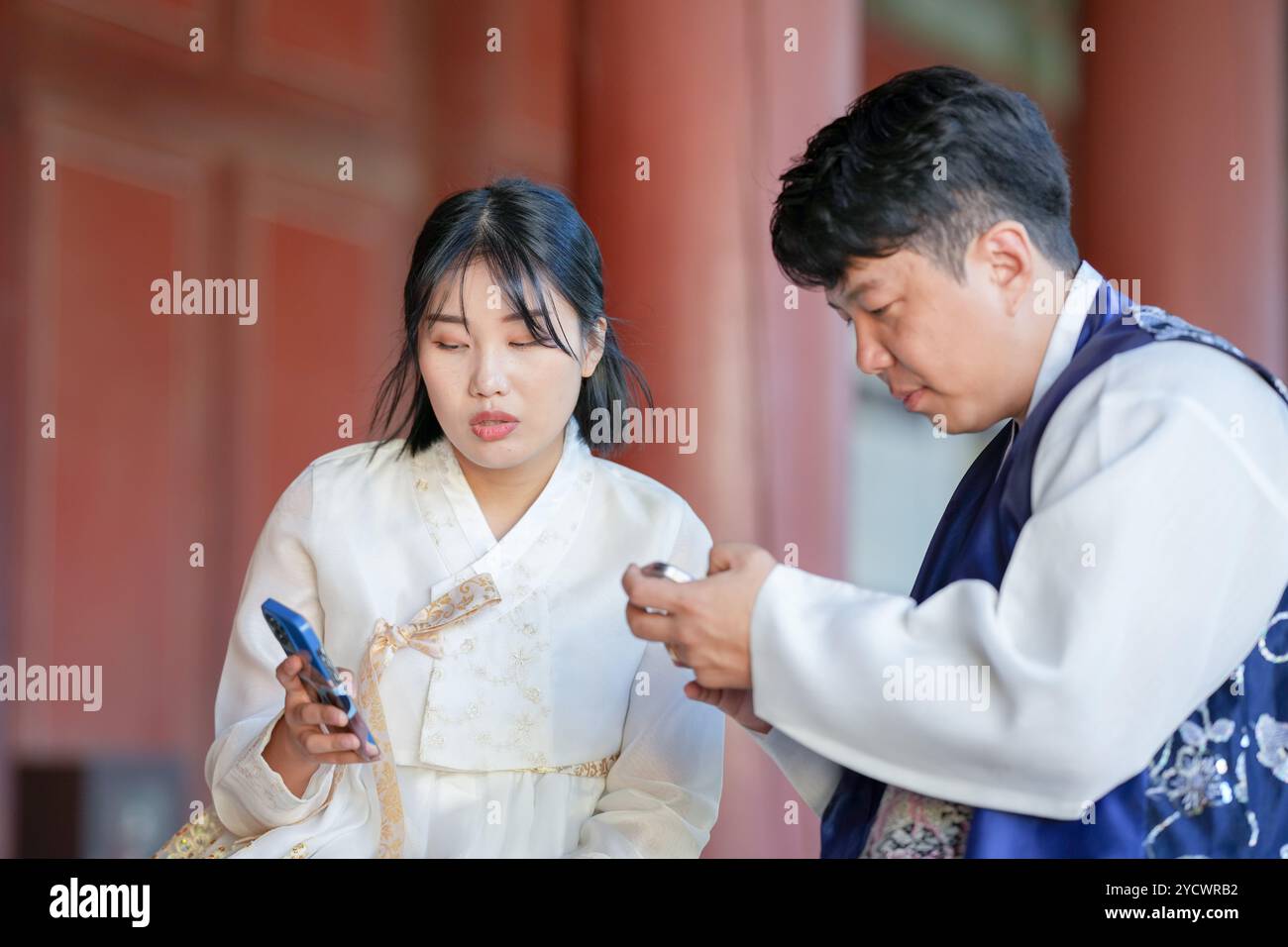 A Korean couple, a man in his 30s and a woman in her 20s, are happily ...