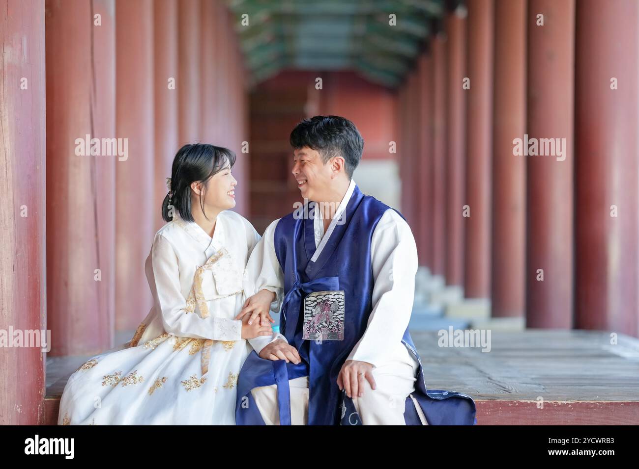 A Korean couple, a man in his 30s and a woman in her 20s, are happily ...