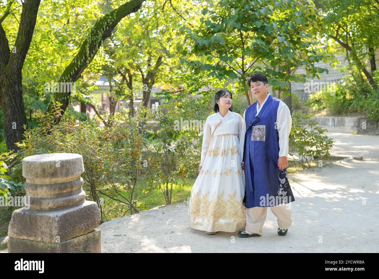 A Korean couple, a man in his 30s and a woman in her 20s, walks ...