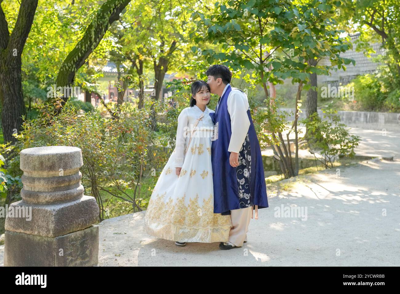 A Korean couple, a man in his 30s and a woman in her 20s, walks ...