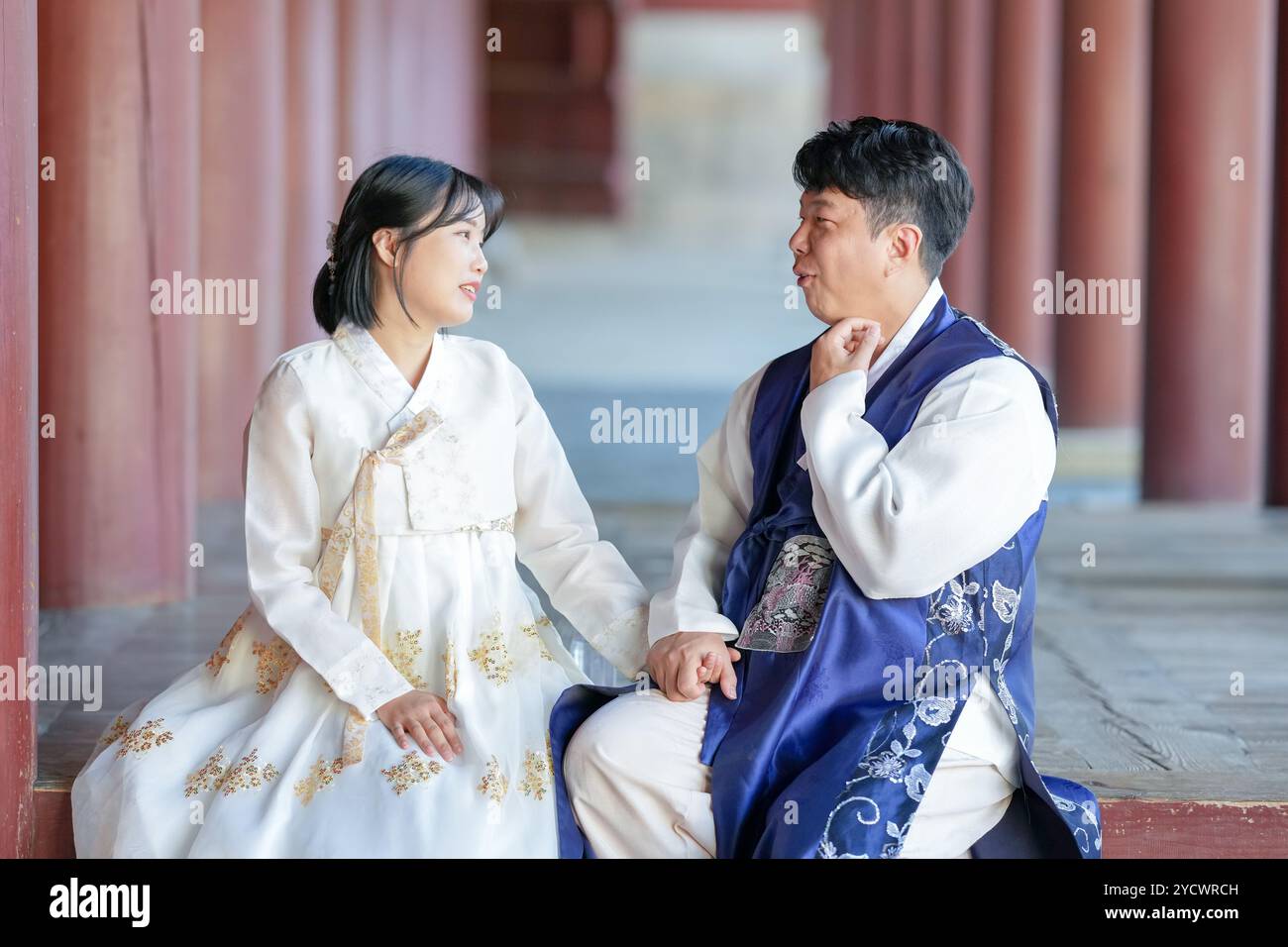 A Korean couple, a man in his 30s and a woman in her 20s, are happily ...