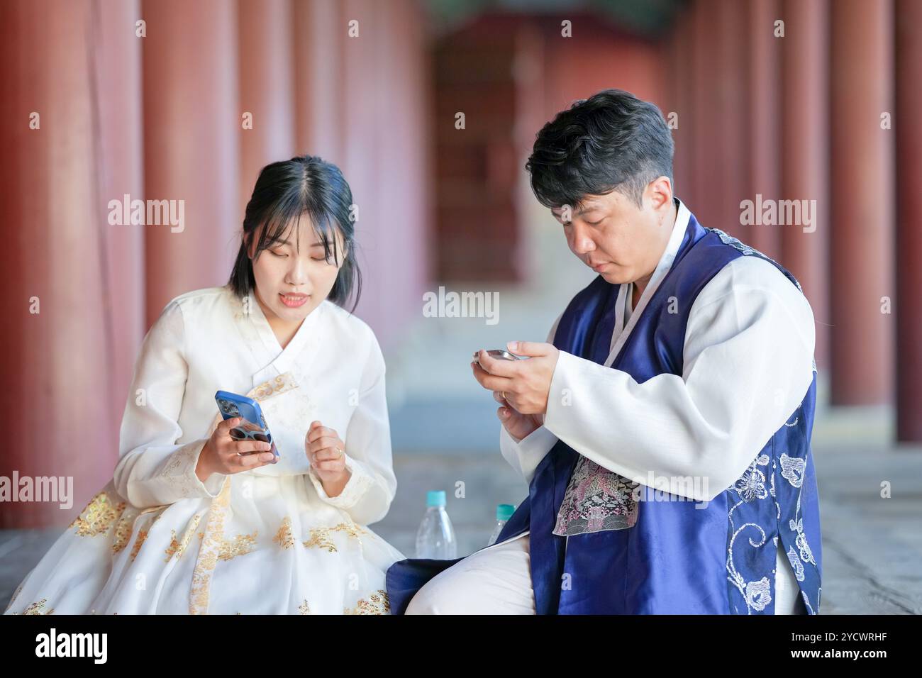 A Korean couple, a man in his 30s and a woman in her 20s, are happily ...