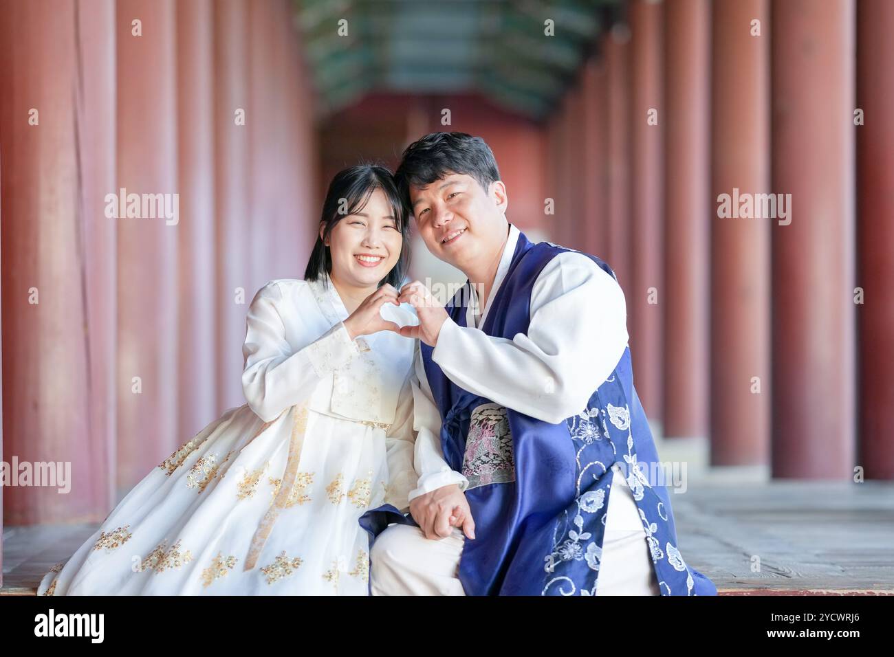 A Korean couple, a man in his 30s and a woman in her 20s, are happily ...