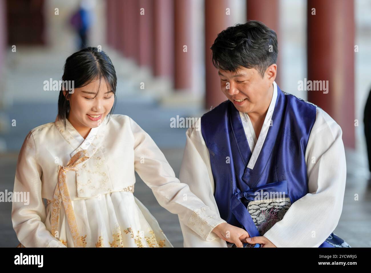 A Korean couple, a man in his 30s and a woman in her 20s, are happily ...