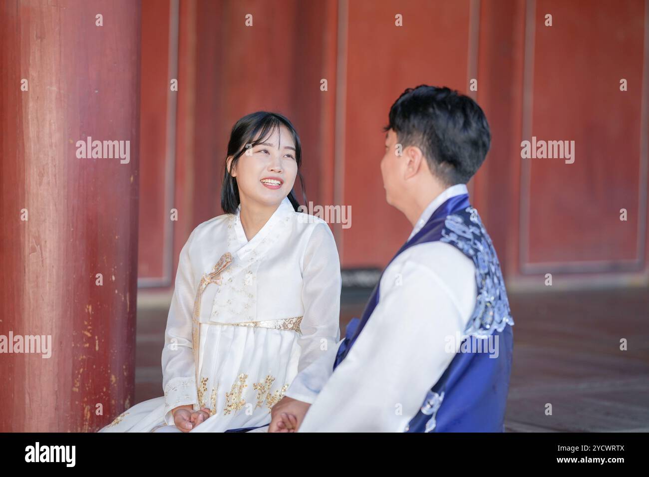 A Korean couple, a man in his 30s and a woman in her 20s, are happily ...