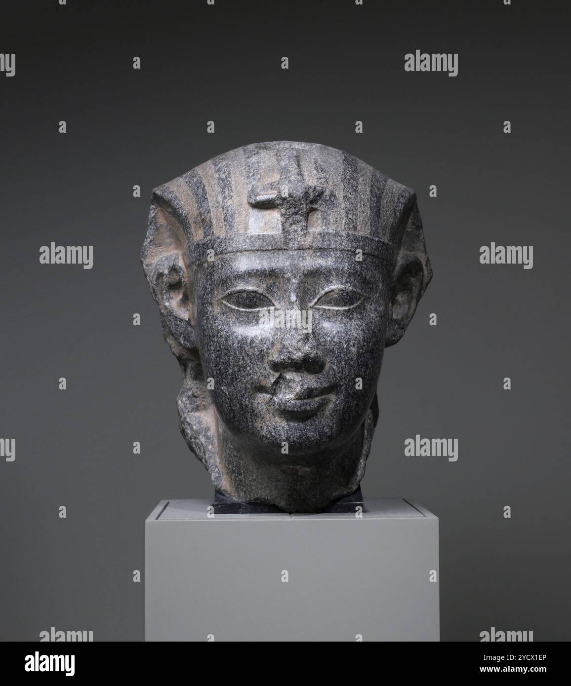 This granite statue depicts Ptolemy II in the traditional canon of ...