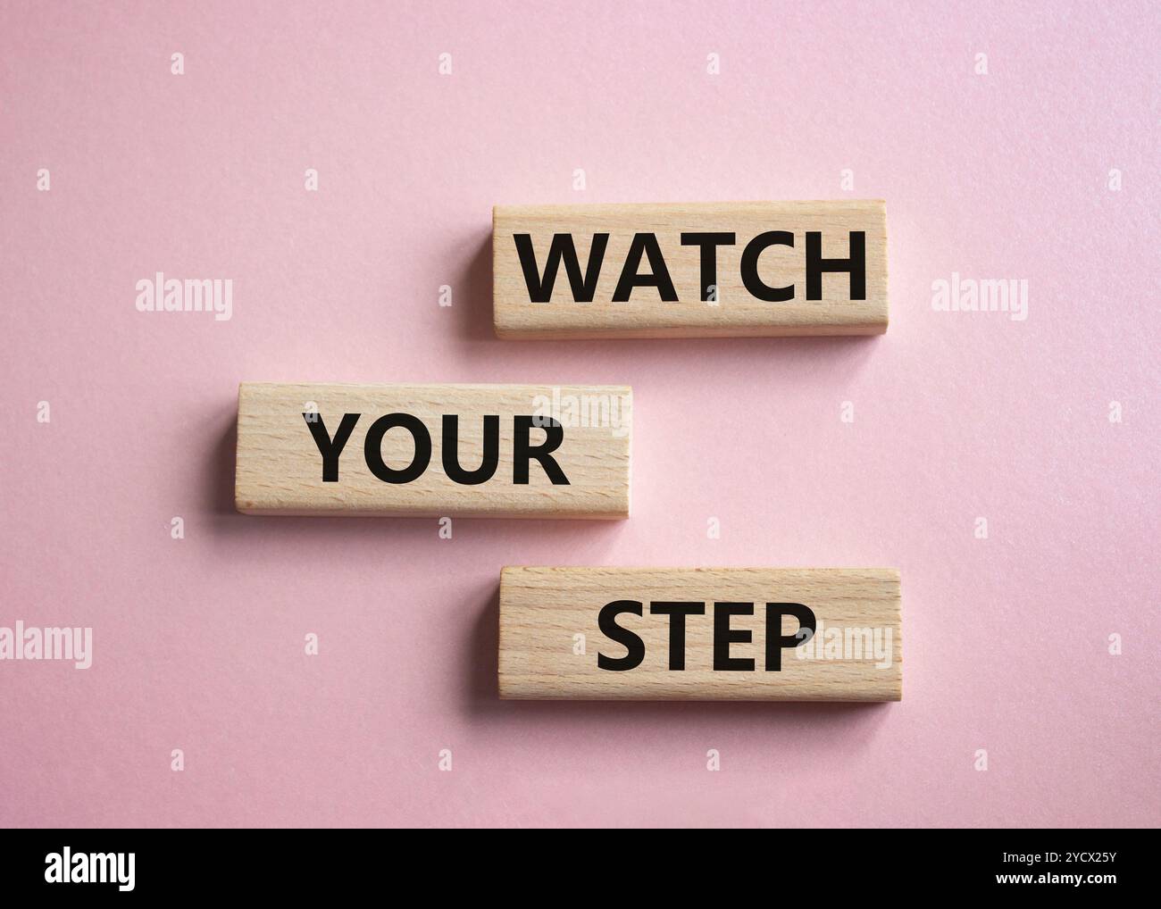 Watch your Step symbol. Concept words Watch your Step on wooden blocks ...