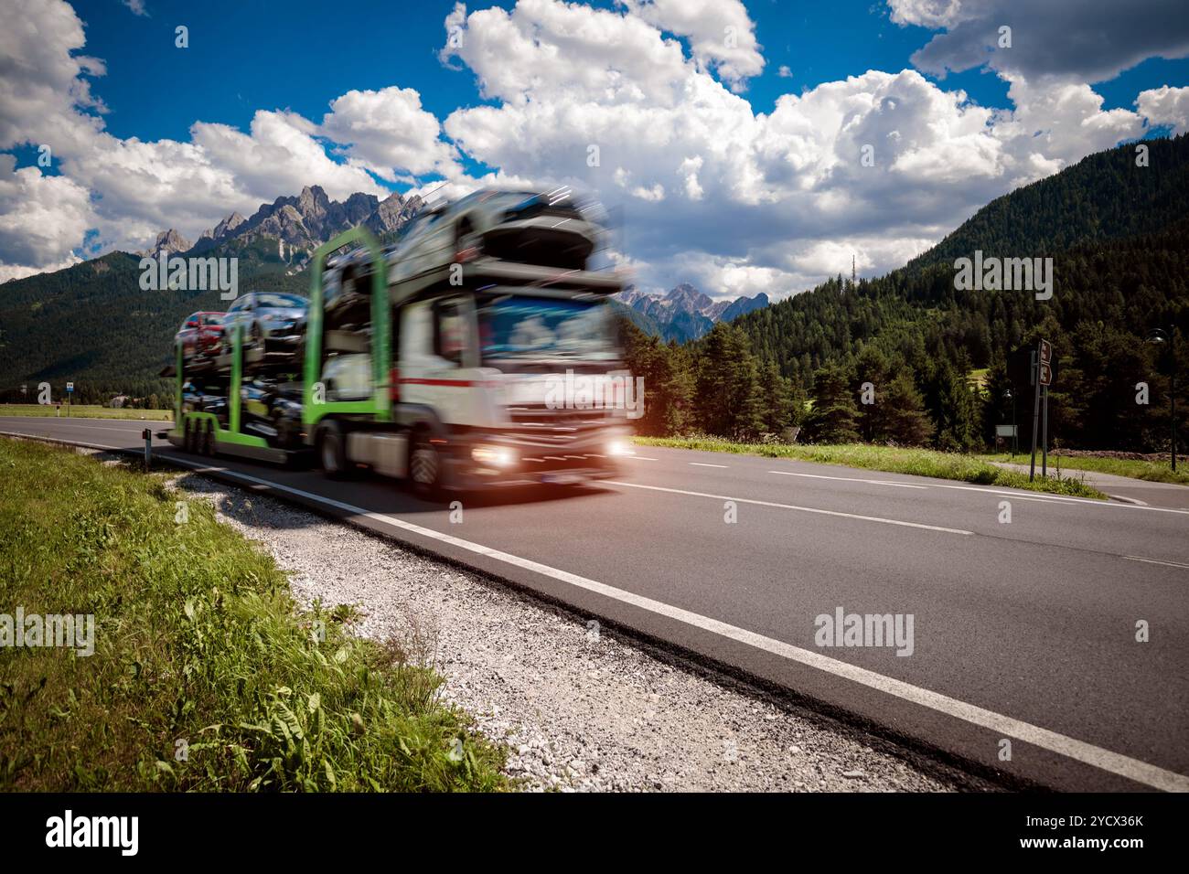 Truck trailer transports new cars rides on highway Stock Photo - Alamy