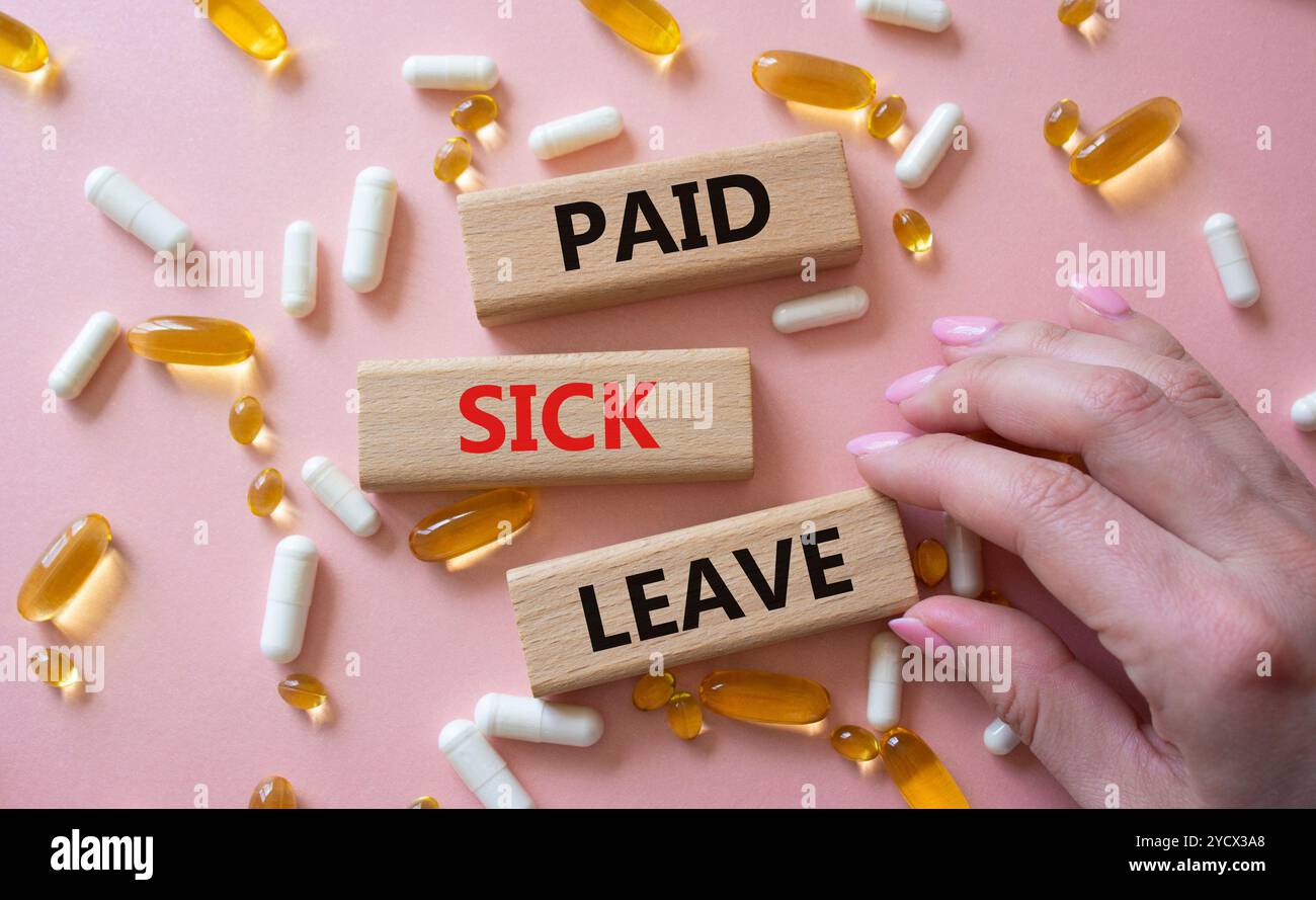 Paid Sick Leave symbol. Concept words Paid Sick Leave on wooden blocks ...