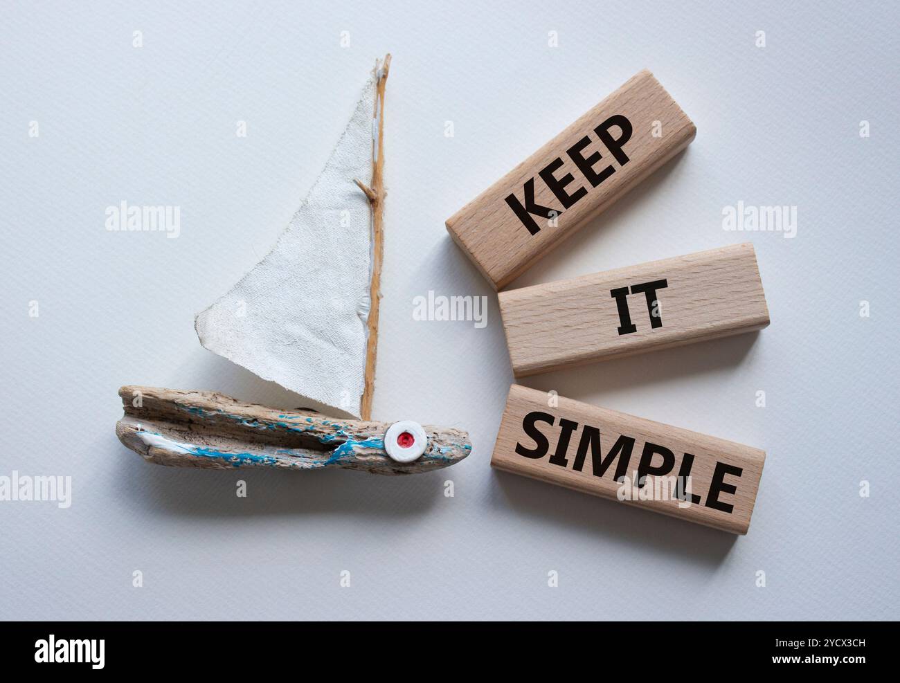 Keep it Simple symbol. Concept words Keep it Simple on wooden blocks ...