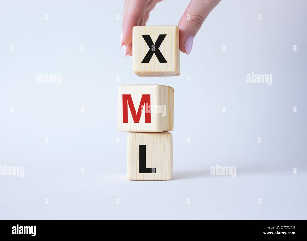 XML - Extensible Markup Language. Wooden cubes with word XML ...