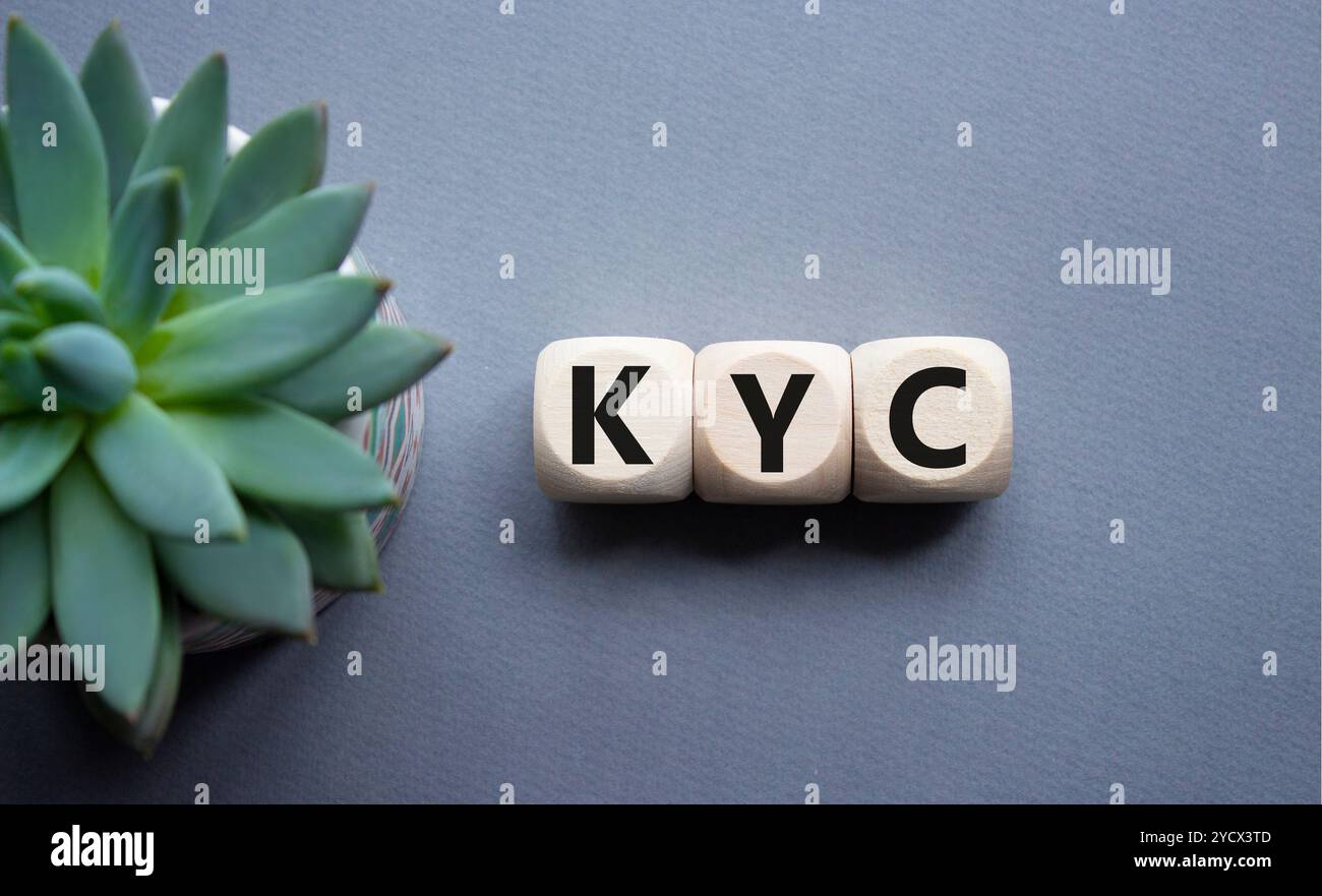 KYC - Know Your Customer. Wooden cubes with word KYC. Beautiful grey ...