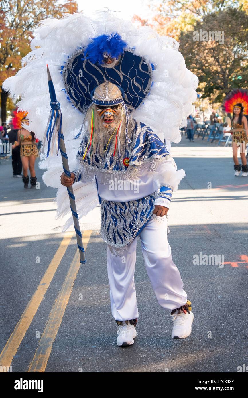 A dancer from Centro Cultural Bolivia group in a costume with mask ...