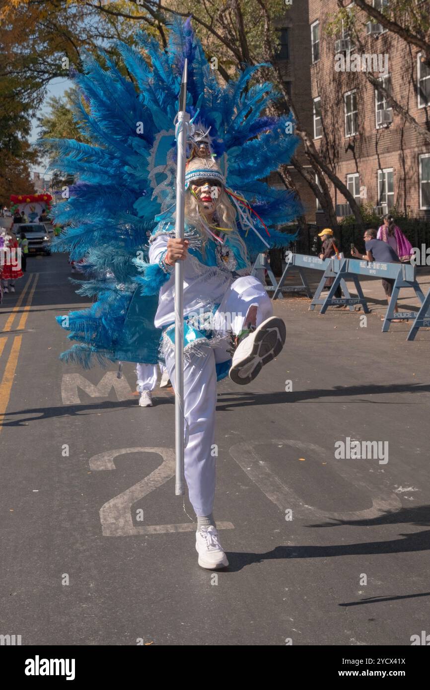Dancer from Centro Cultural Bolivia group in a costume with mask & blue ...