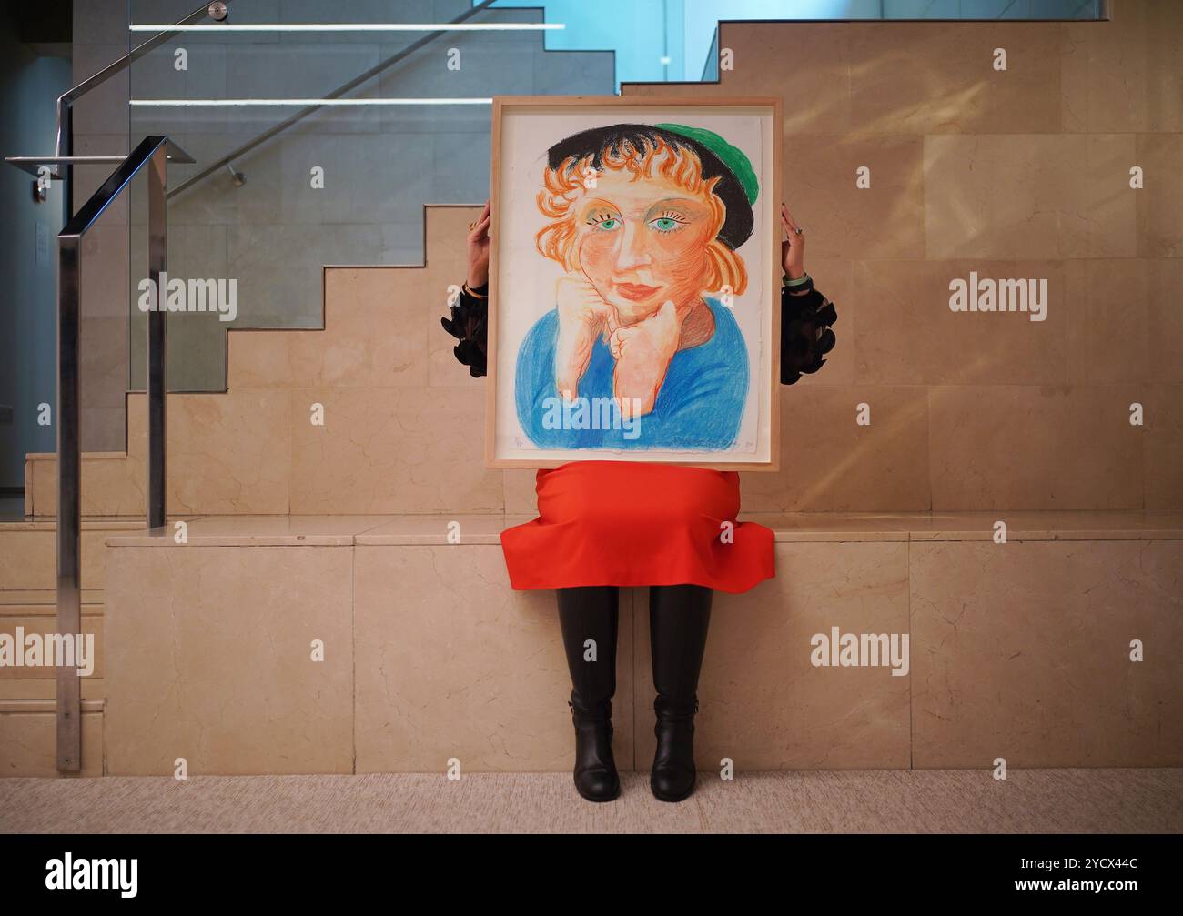 A member of gallery staff holding a piece by David Hockney, Celia with ...