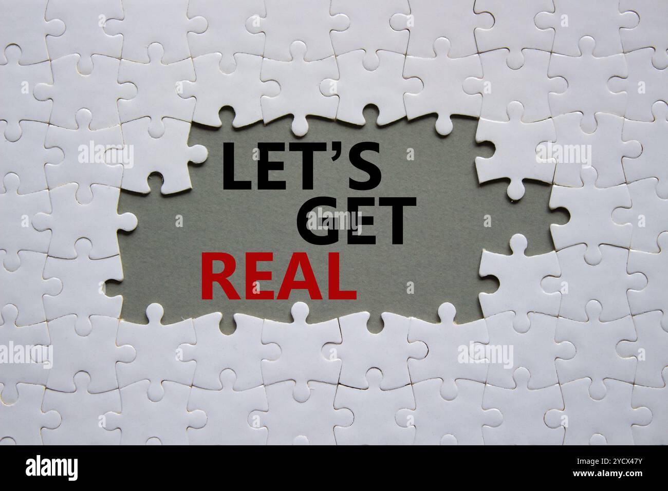 Lets get real symbol. Concept words Lets get real on white puzzle ...