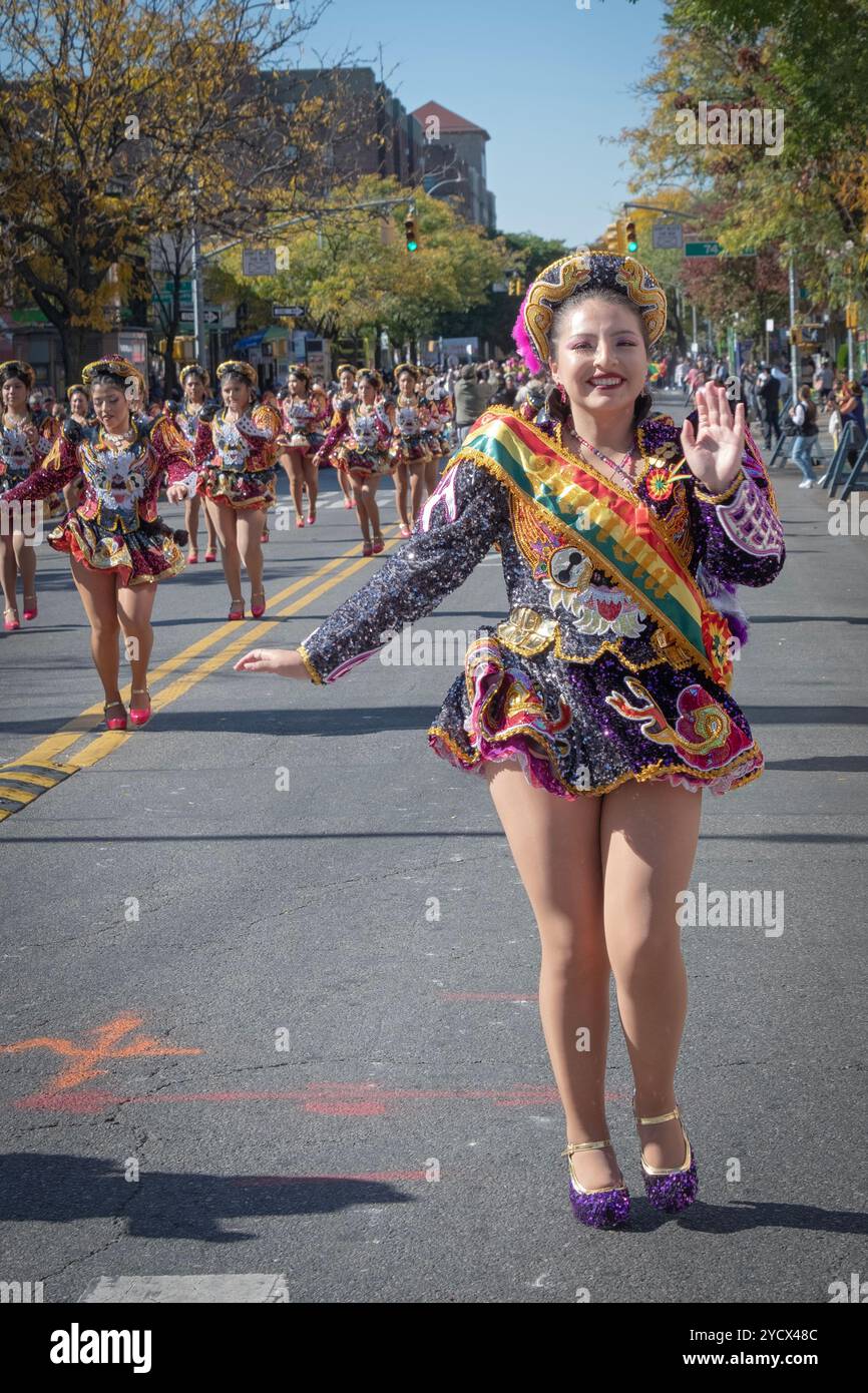 A happy dancer from the San Simon troupe leads a group at the Bolivian ...