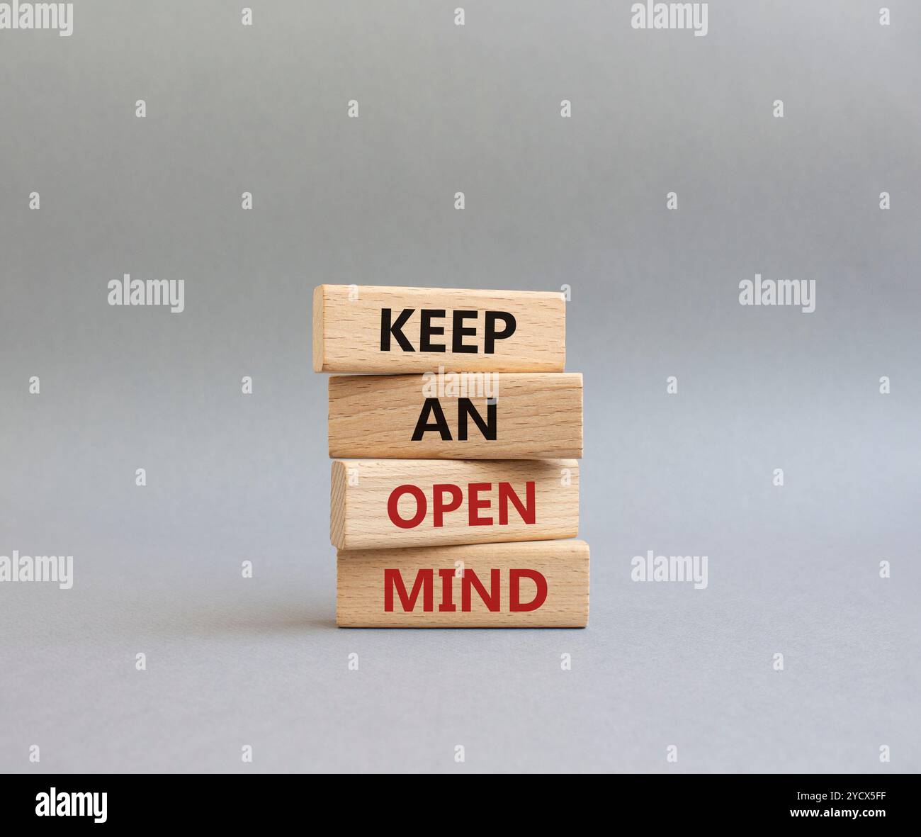 Keep an open mind symbol. Wooden blocks with words Keep an open mind. Beautiful grey background ...