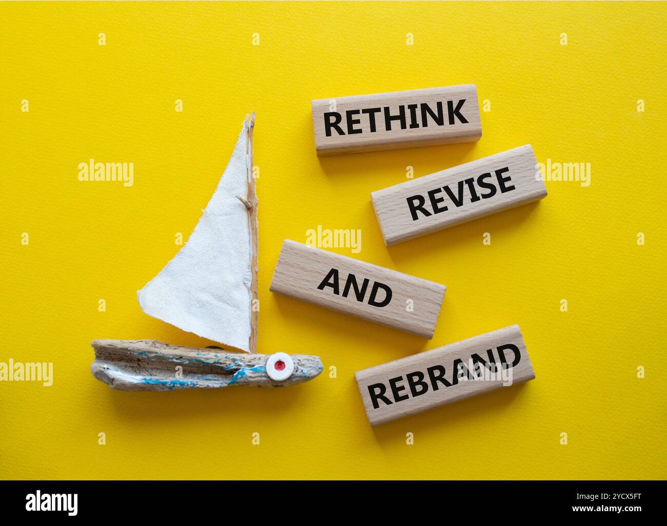 Rethink Revise and Rebrand symbol. Wooden blocks with words Rethink ...