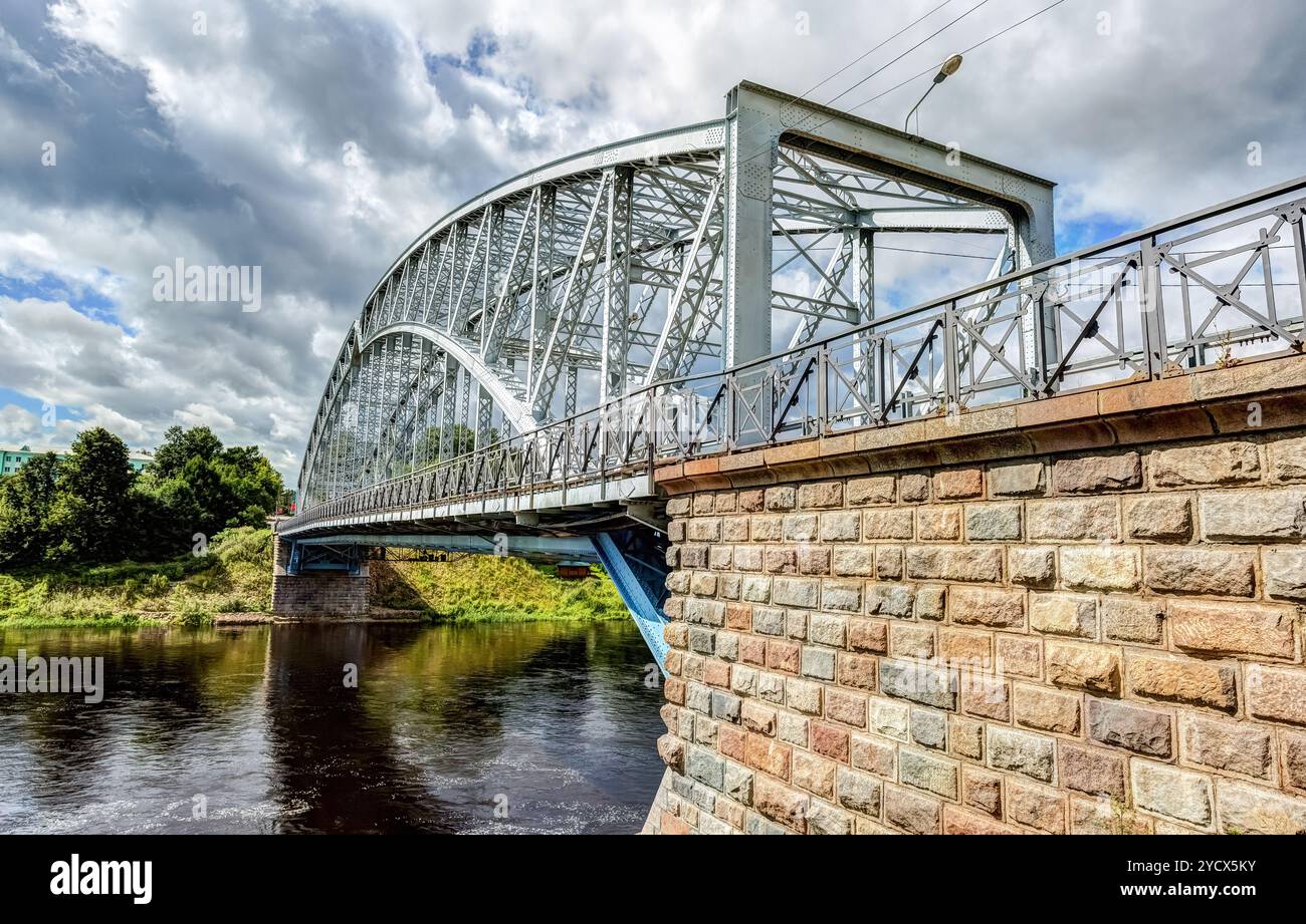 First in Russia steel arch bridge on river Msta in sunny summer day ...