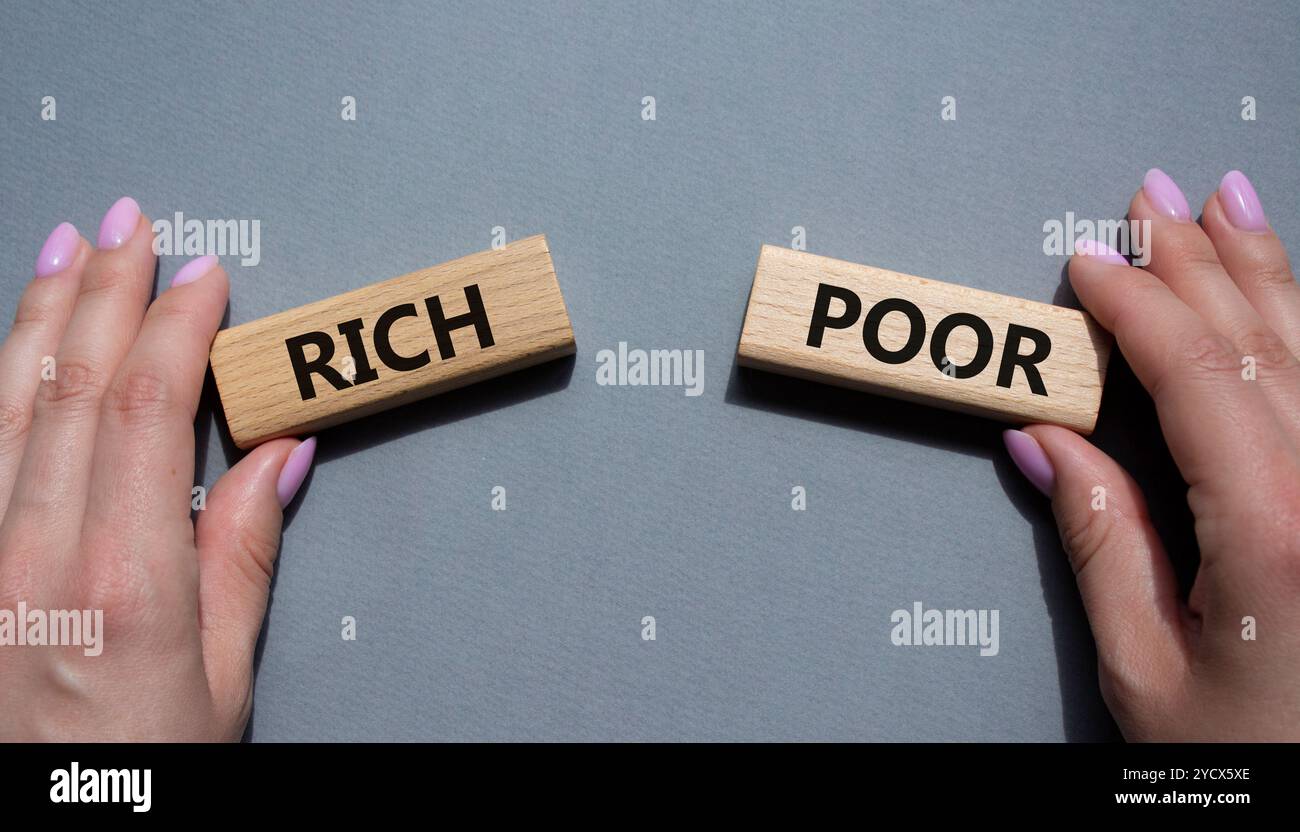 Rich vs Poor symbol. Concept word Rich vs Poor on wooden blocks ...