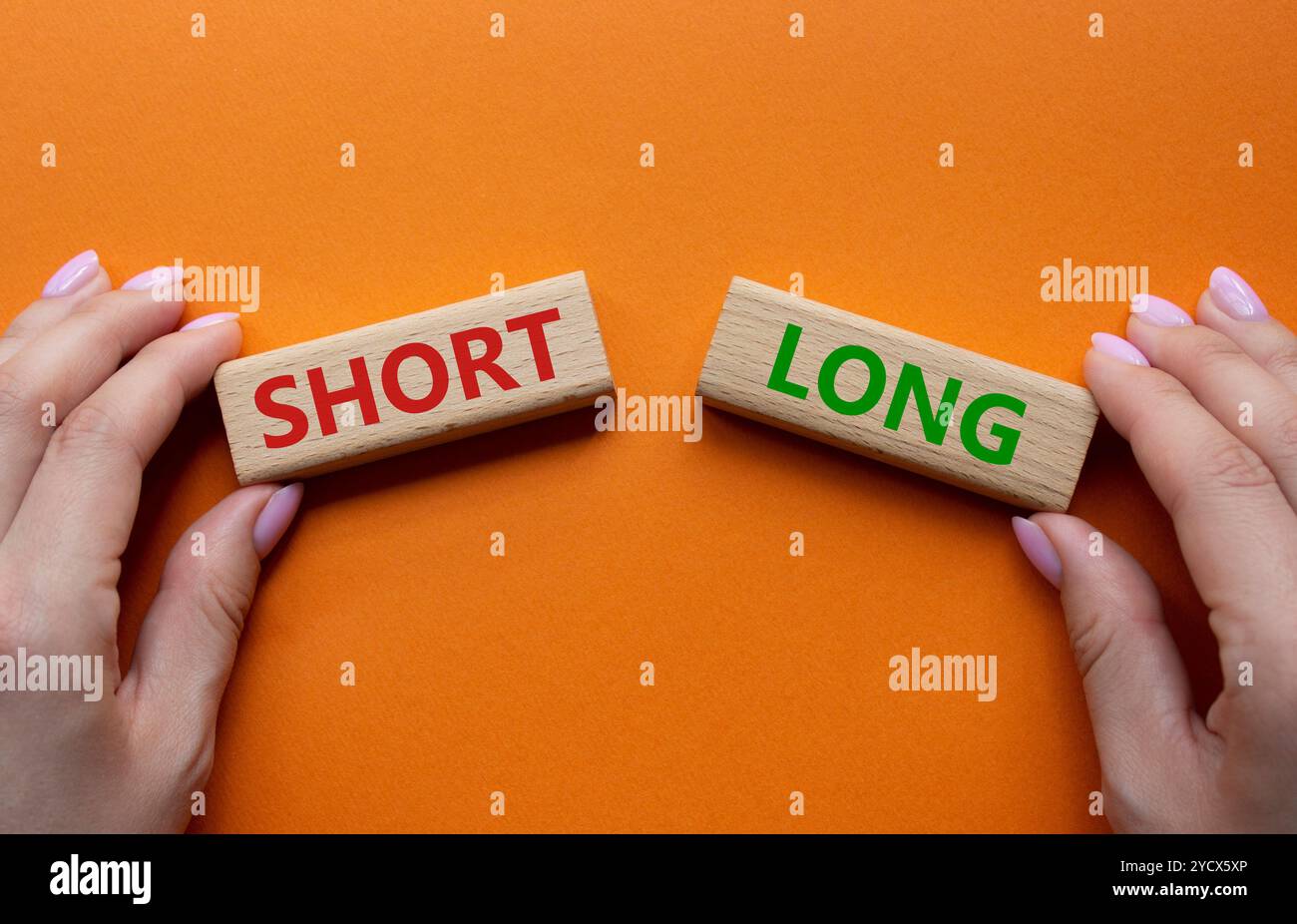 Short vs Long symbol. Concept word Short vs Long on wooden blocks ...