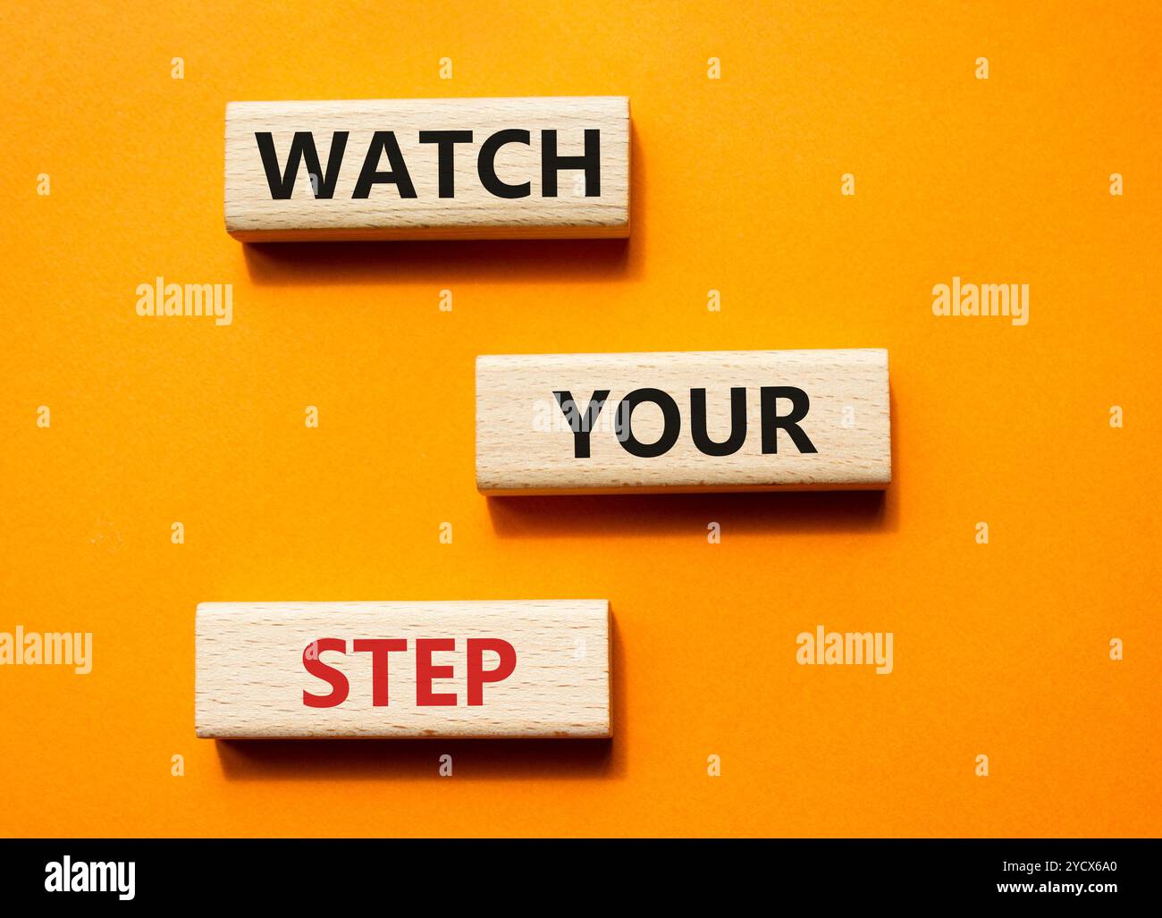 Watch your Step symbol. Concept words Watch your Step on wooden blocks ...
