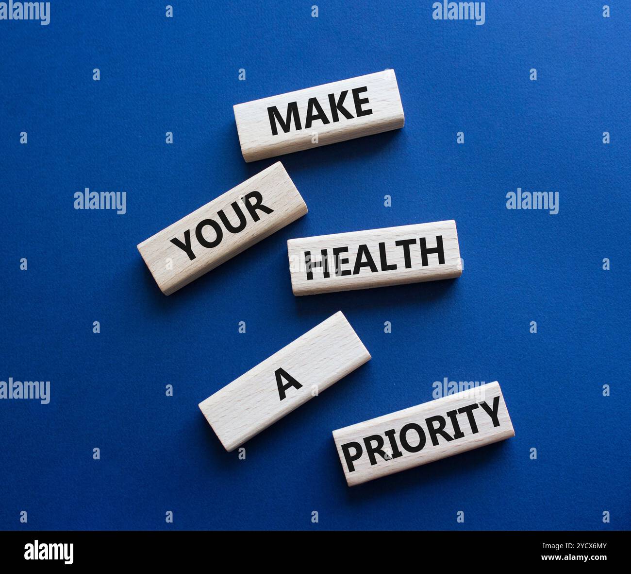 Health symbol. Wooden blocks with words Make your health a Priority ...