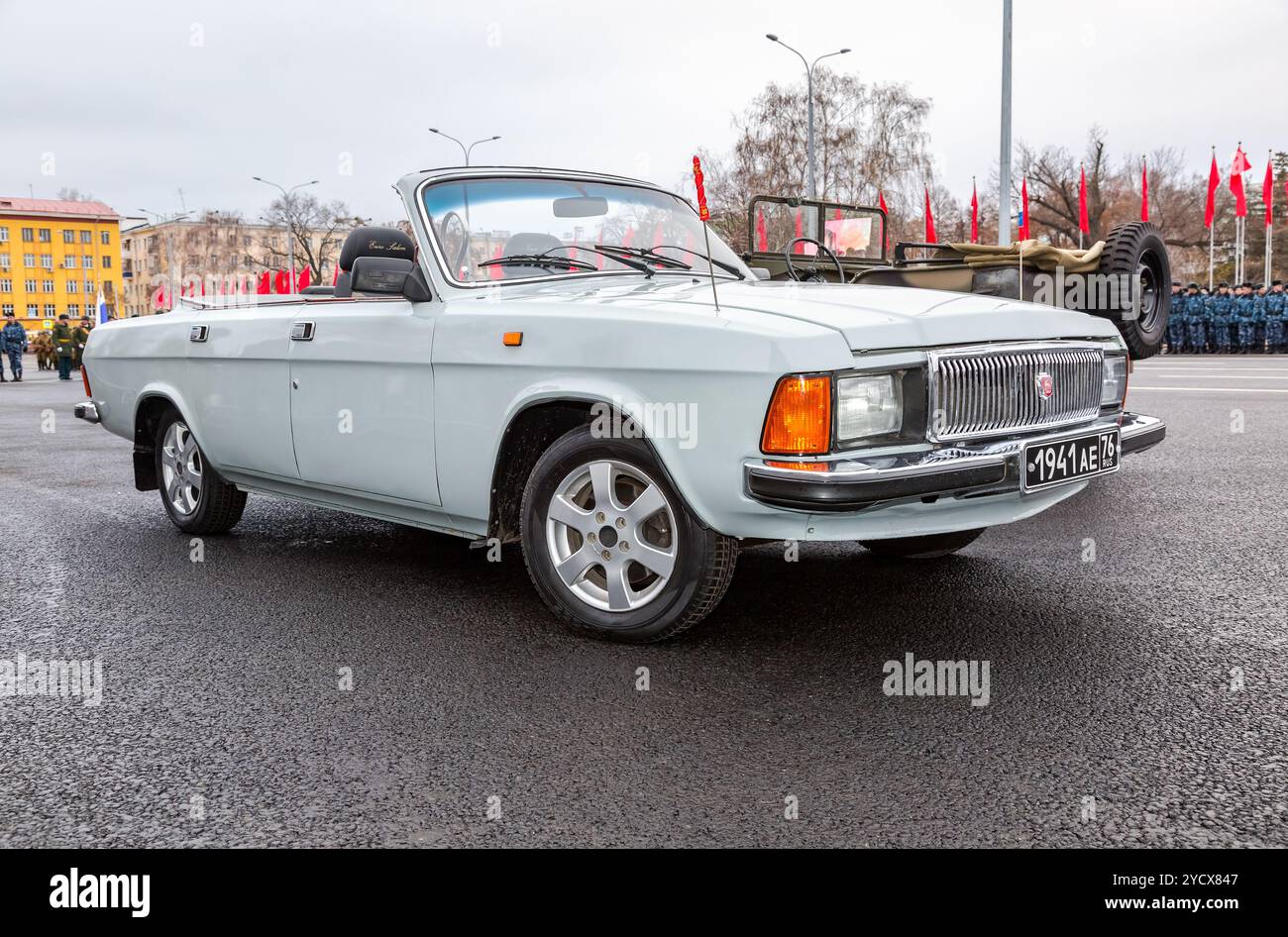 Parade vehicle GAZ 3102 Volga at the city square during the rehearsal ...