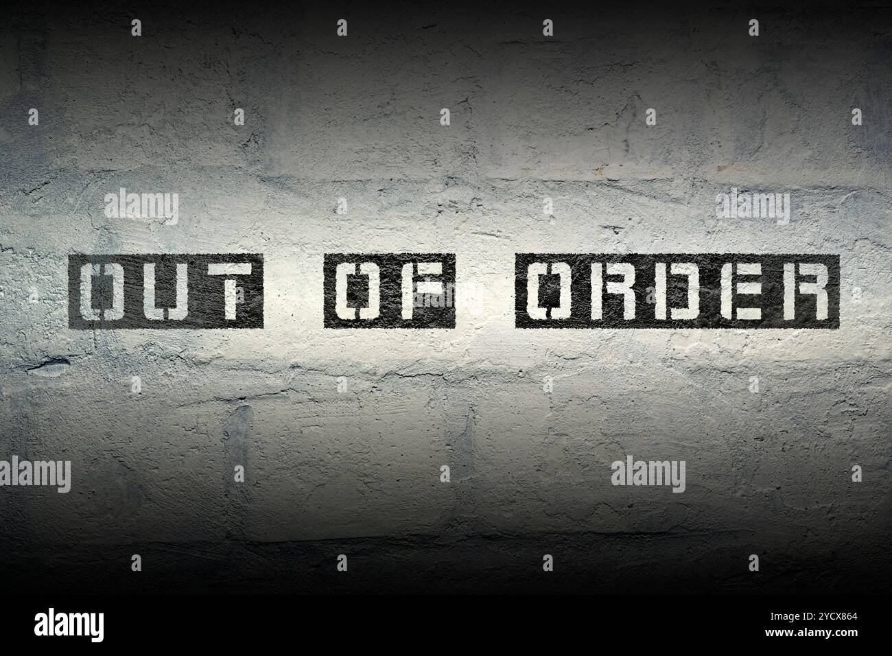 out of order stencil print on the grunge white brick wall Stock Photo ...