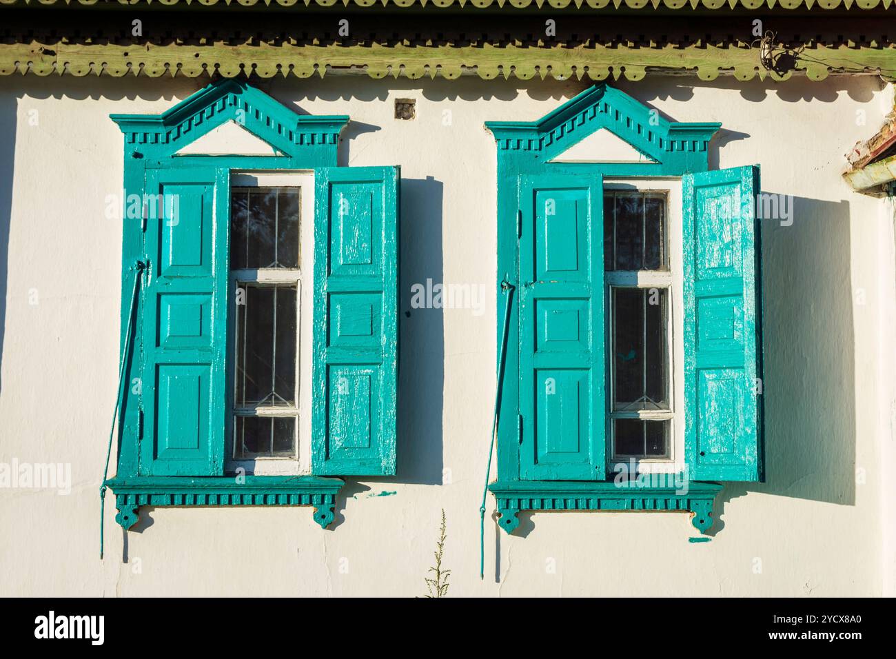 Windows with turquoise shutters Stock Photo - Alamy