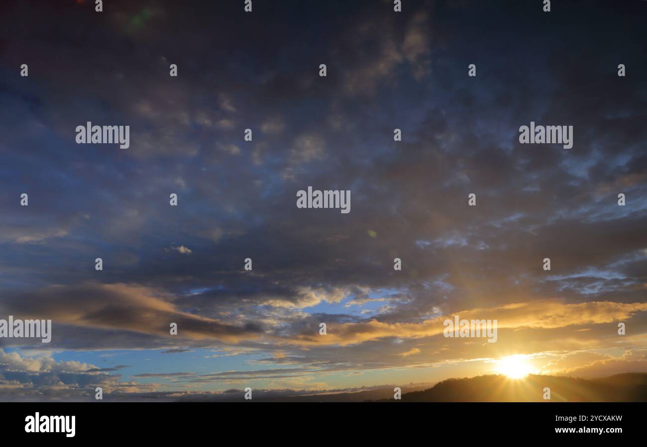 Setting sun behind mountain hi-res stock photography and images - Alamy