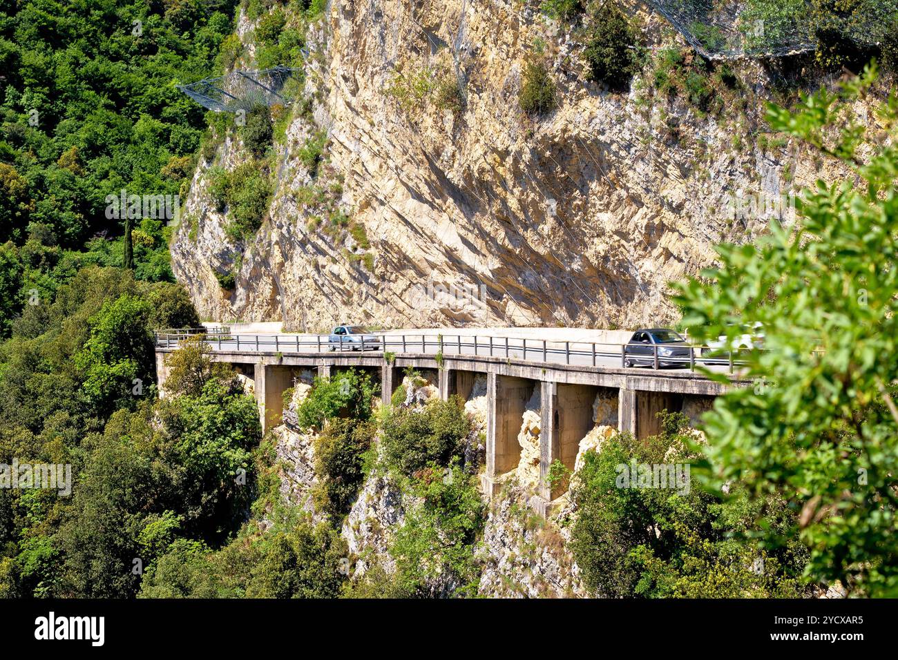 Dangerous cliff road above Garda lake Stock Photo - Alamy