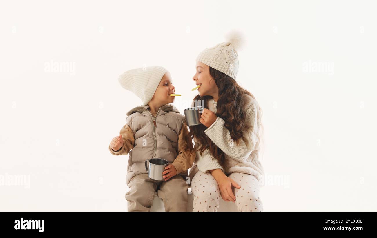 Kids share sweet moment, sipping their drinks and enjoying peaceful ...