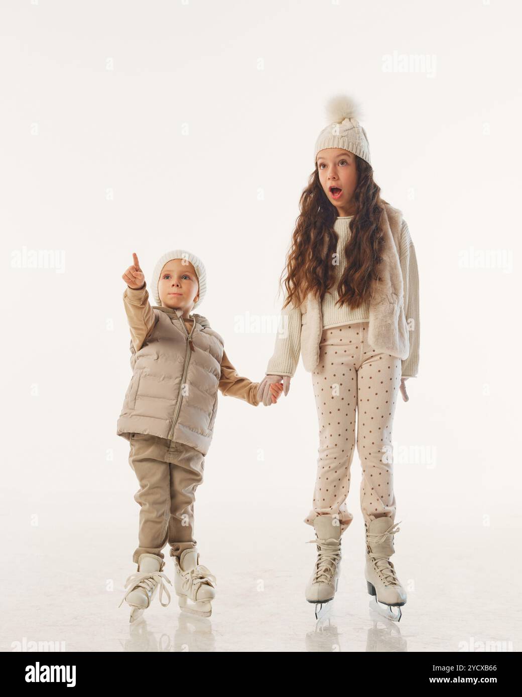 Kids spot something exciting as they continue their skating fun, filled ...