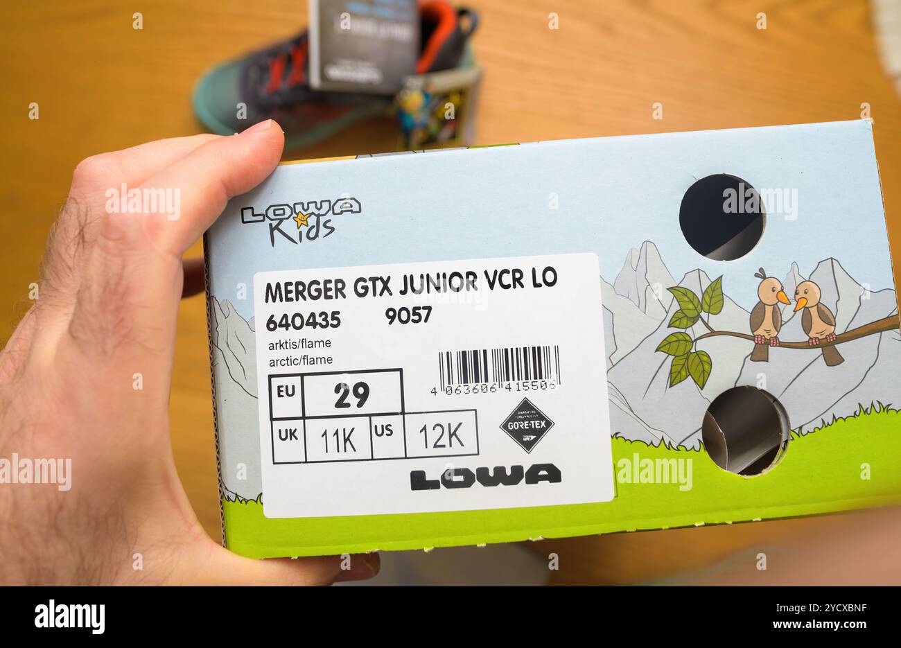 Paris, France - Apr 13, 2024: A close-up of a hand holding a Lowa Kids ...