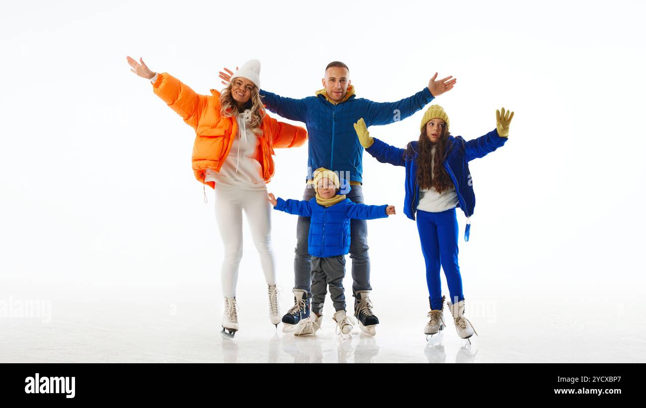 Family spread their arms wide, embracing fun of family time on ice ...