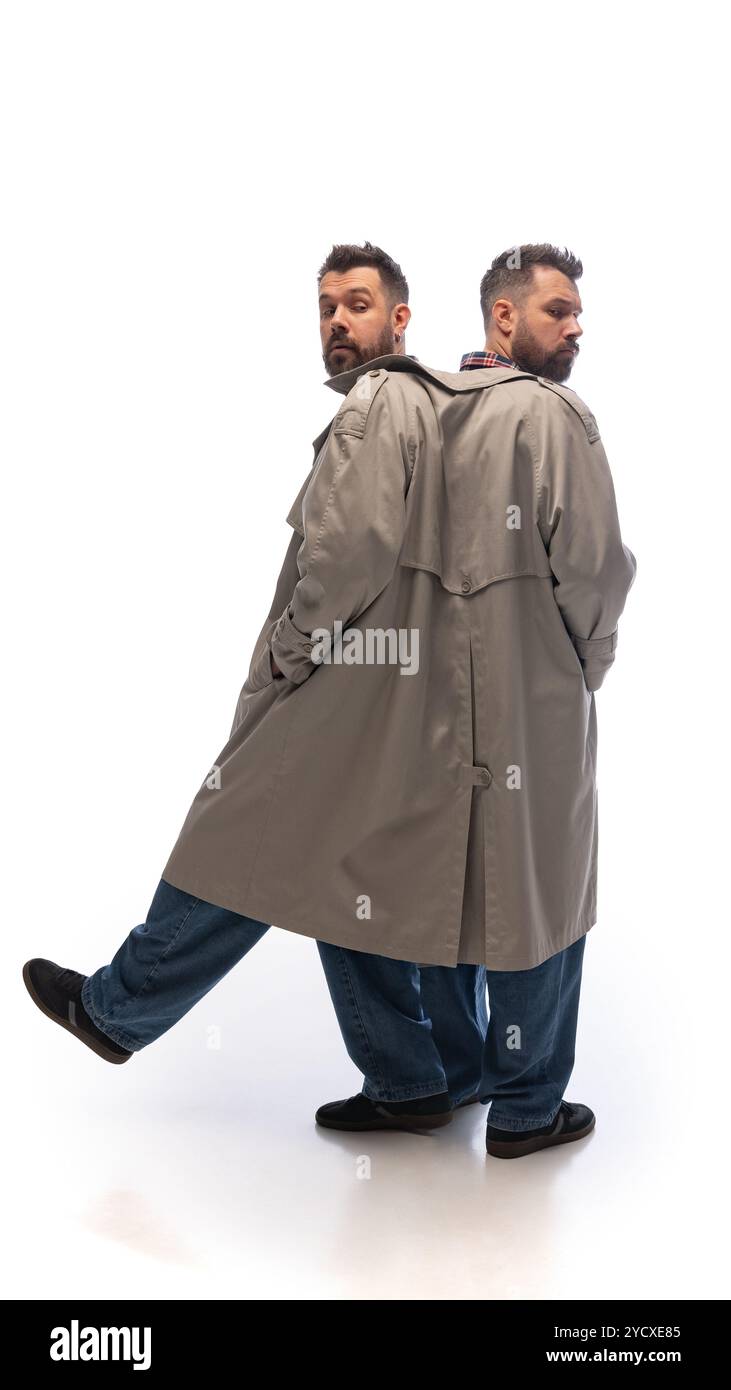 Men in one trench coat, standing back to back, striking fun pose ...
