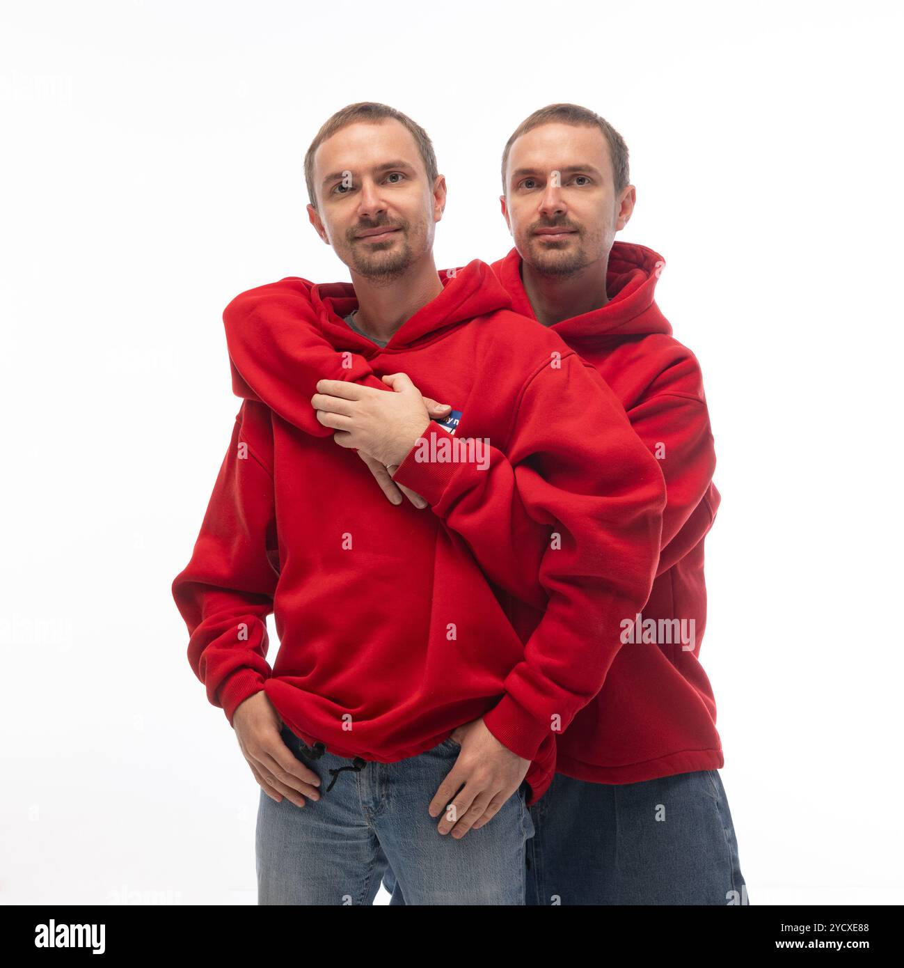 Portrait of two brothers posing in matching casual style outfits ...